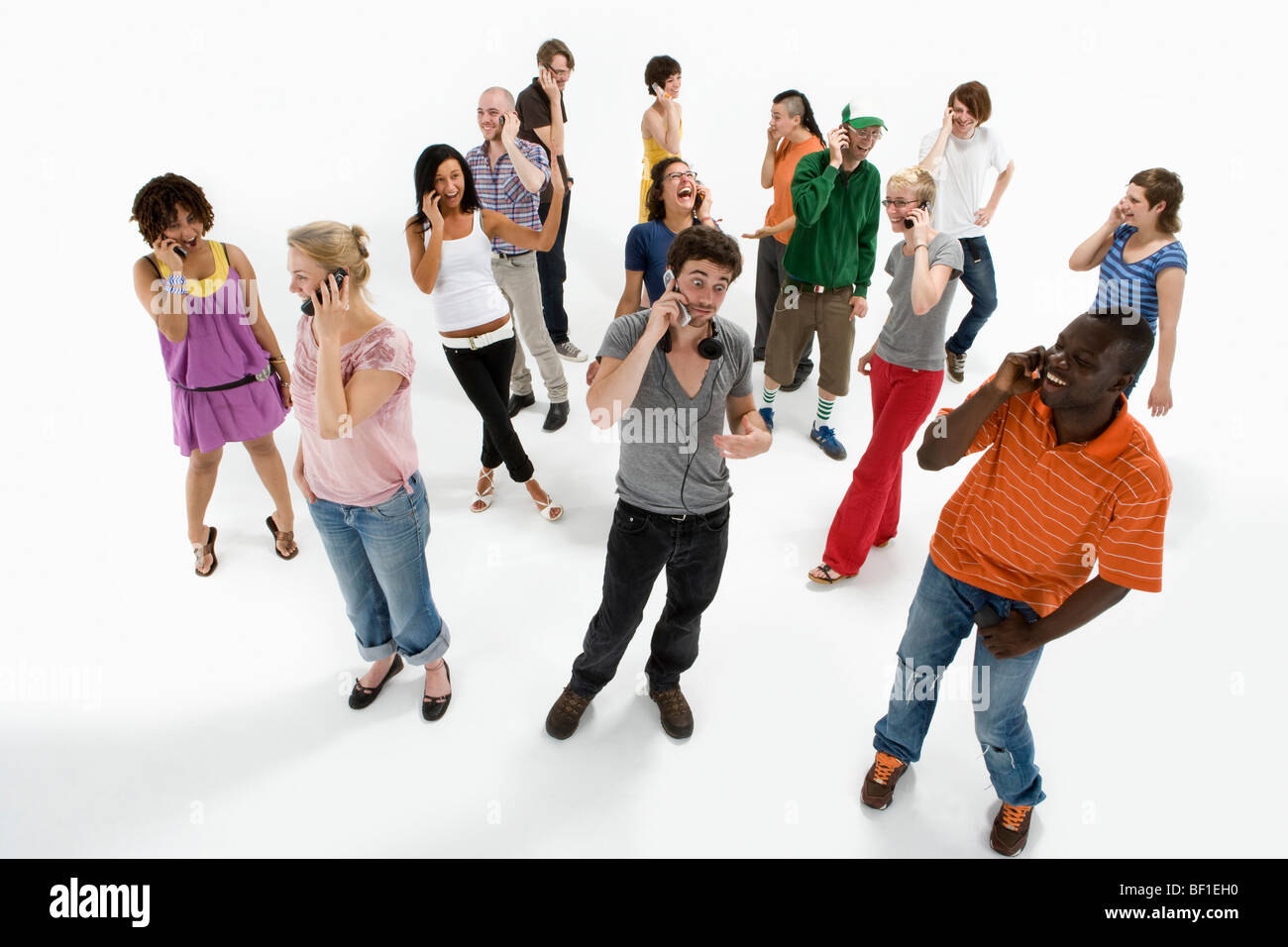 Large group people mobile phones hi-res stock photography and images ...