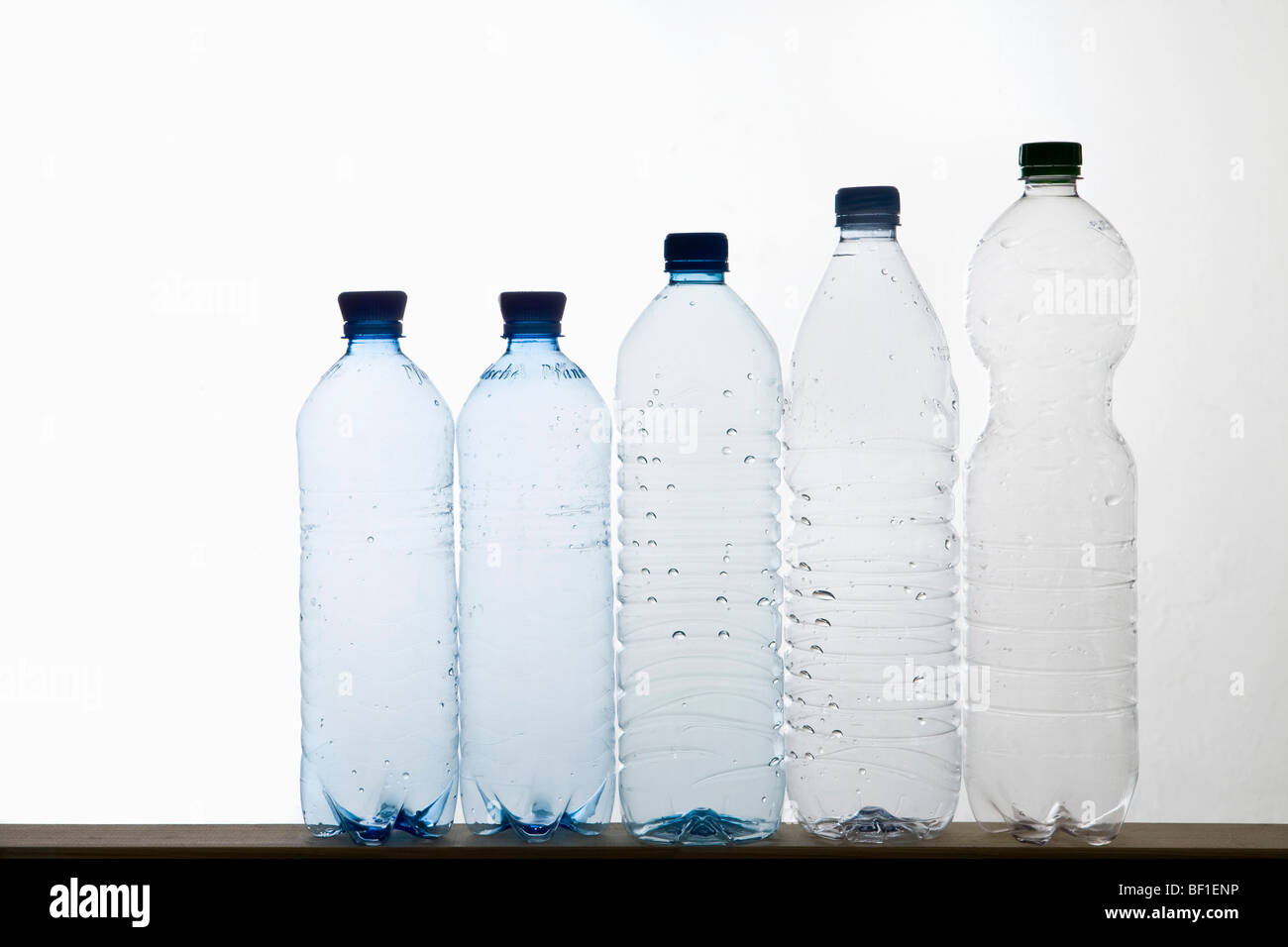A row of plastic water bottles Stock Photo - Alamy