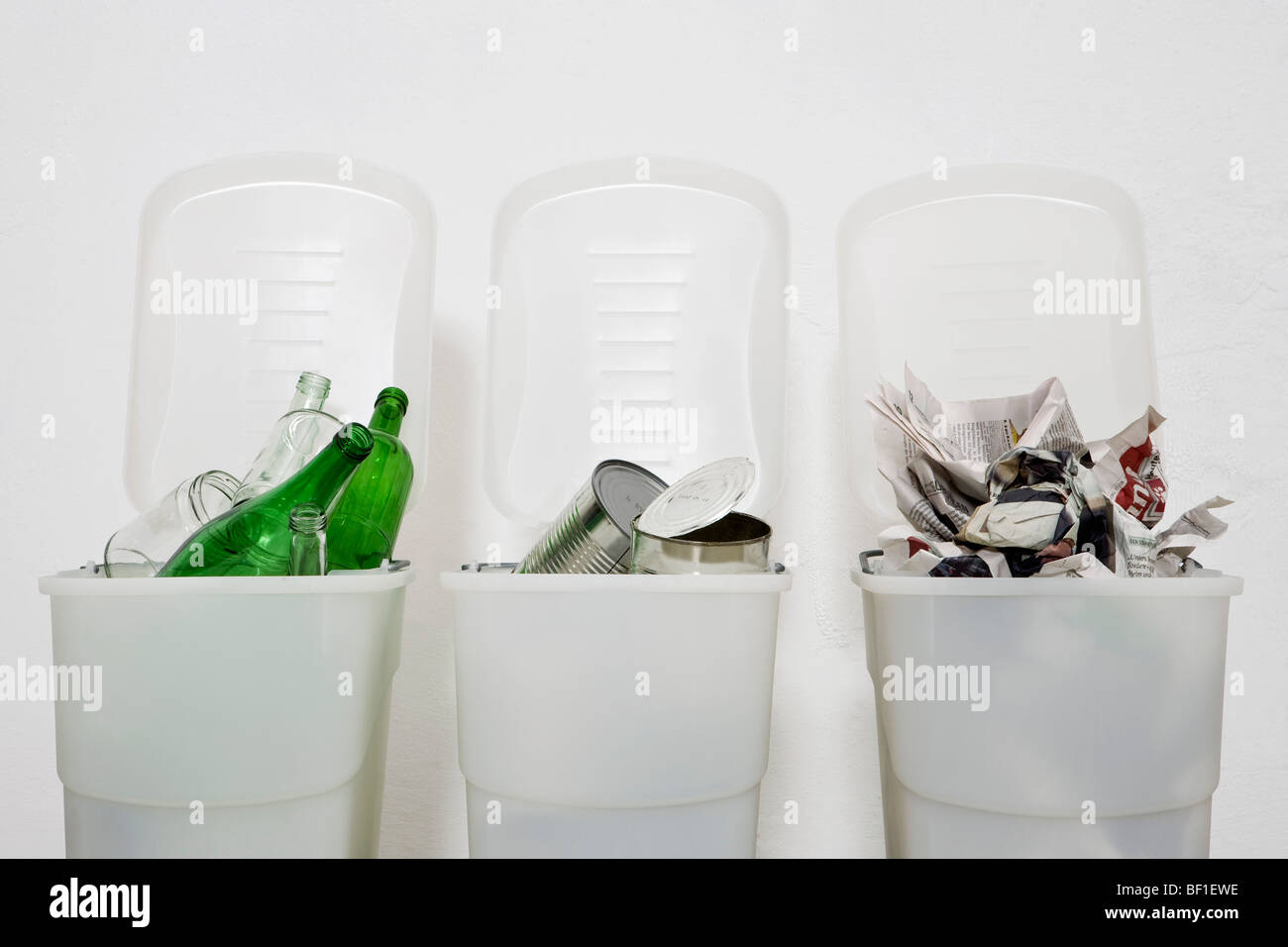 Three full recycling bins Stock Photo - Alamy