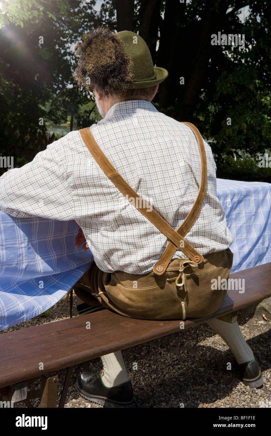 A traditionally clothed German man in a beer garden, rear view Stock ...
