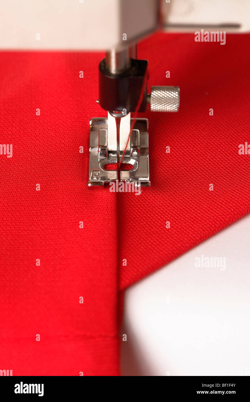 Detail of a sewing machine stitching fabric Stock Photo - Alamy