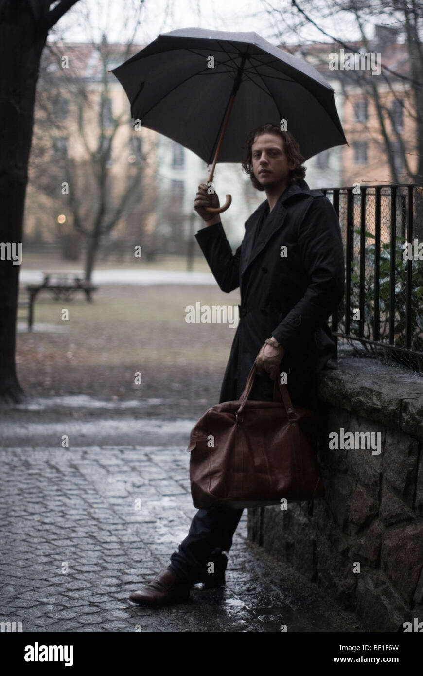 A man holding an umbrella, Sweden Stock Photo - Alamy