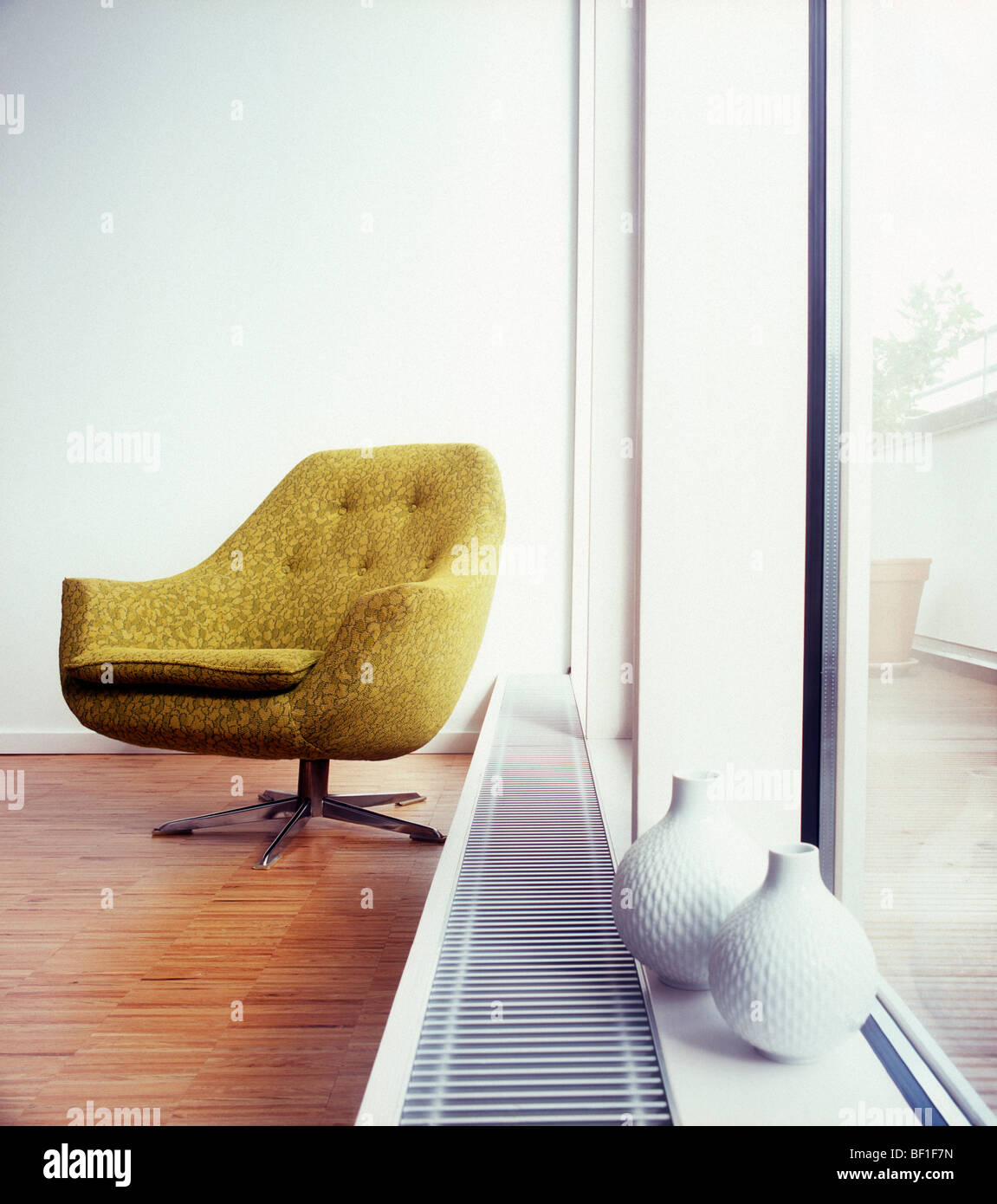 An arm chair next to a window Stock Photo - Alamy
