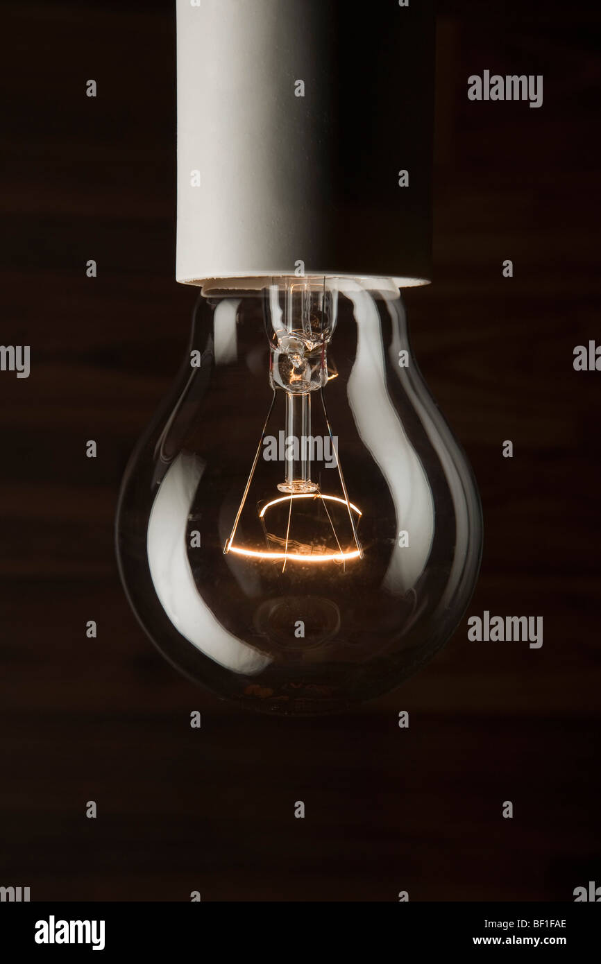 An illuminated light bulb, extreme close-up Stock Photo - Alamy