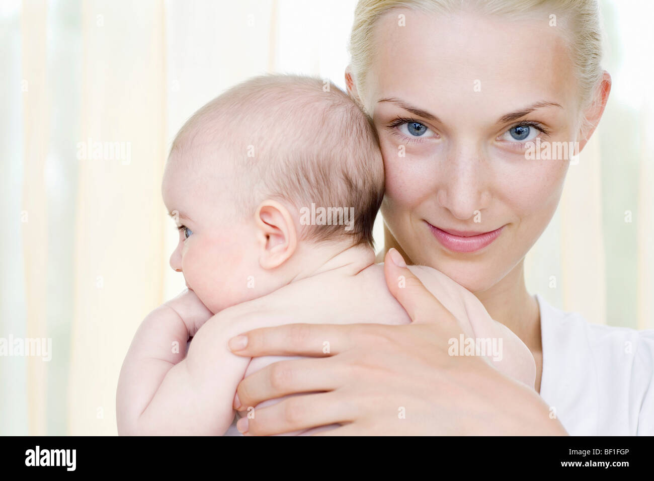 A mother holding her baby daughter Stock Photo - Alamy A mother holding her baby daughter Stock Photo - Alamy