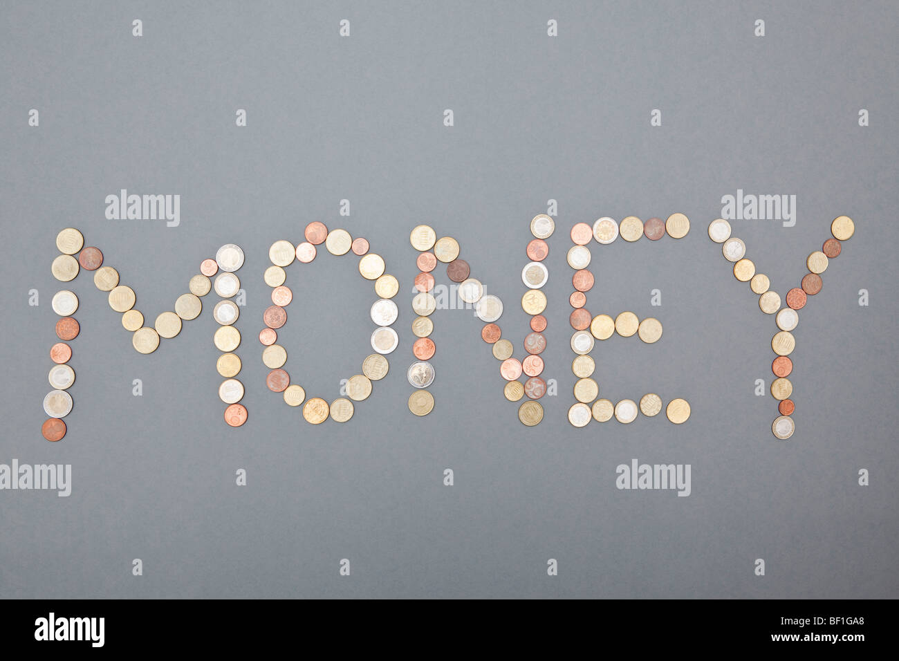 Coins spelling out MONEY Stock Photo - Alamy