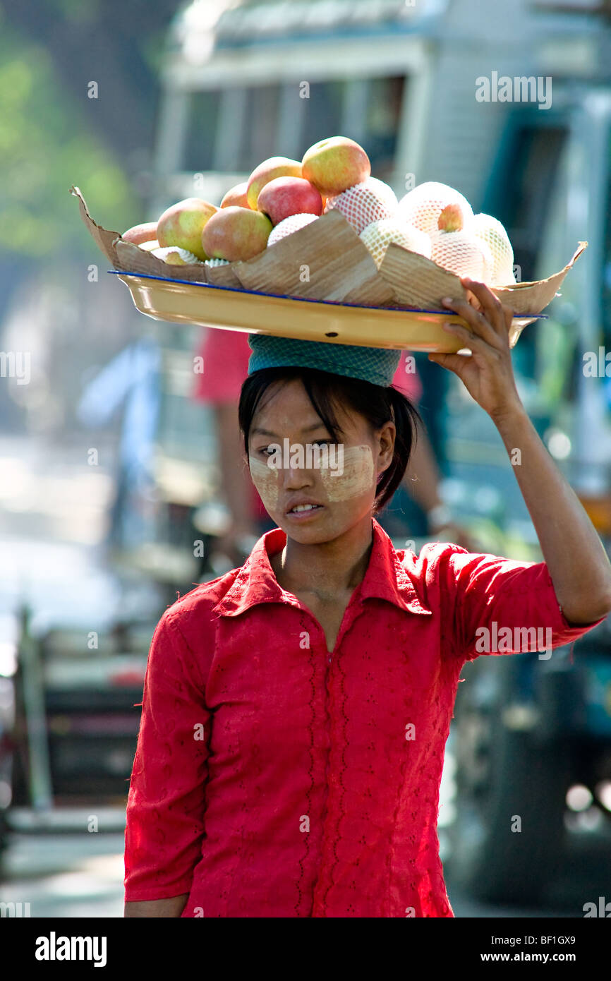 Woman with basket on her head selling fruit, Mandalay Myanmar Stock ...