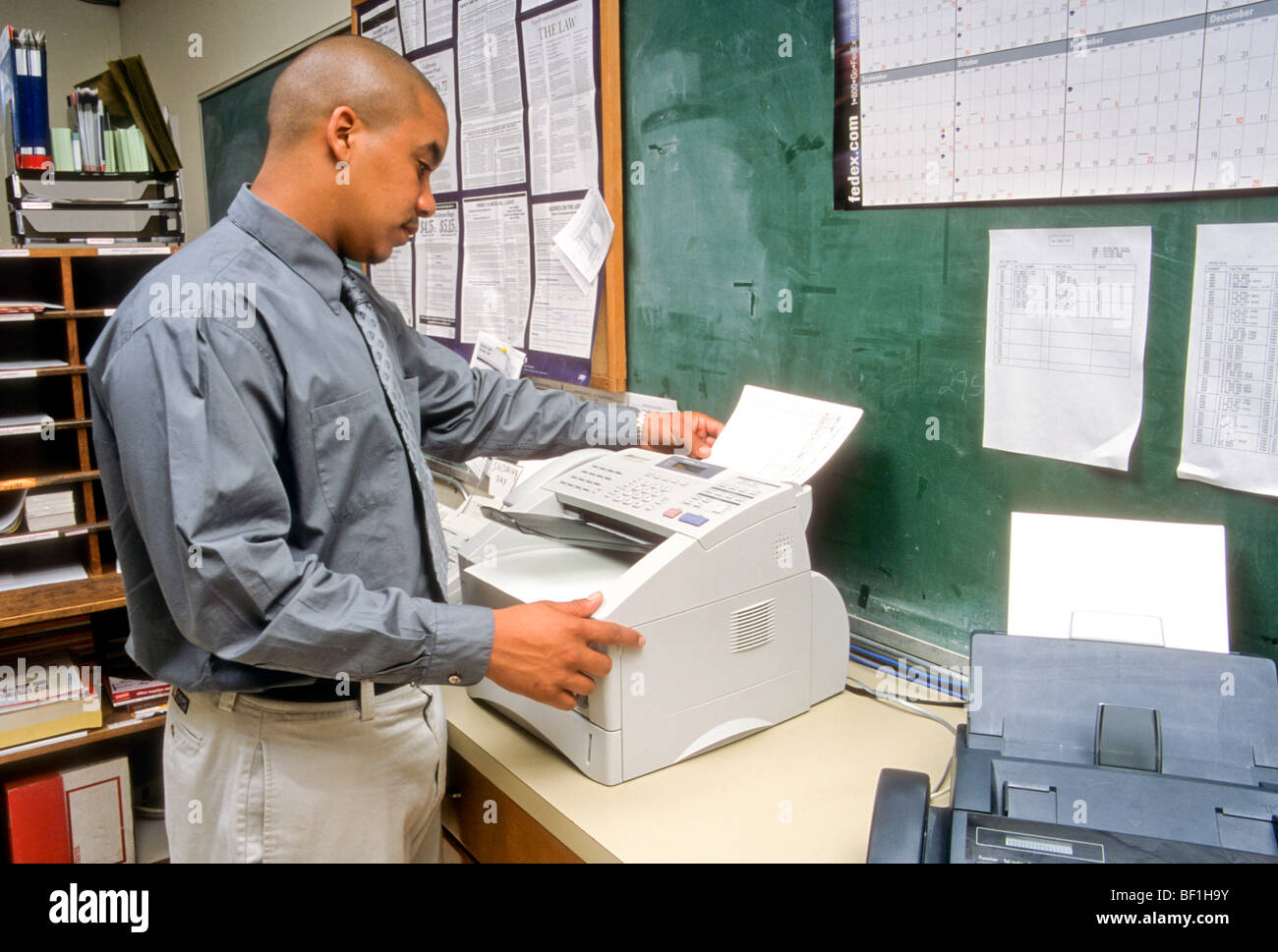 fax copy work employee operate Stock Photo - Alamy