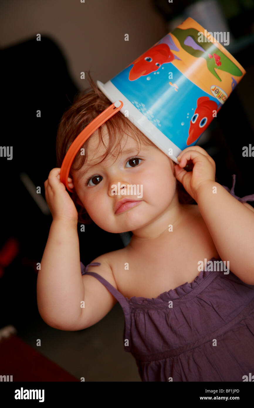 Child bucket on head hi-res stock photography and images - Alamy