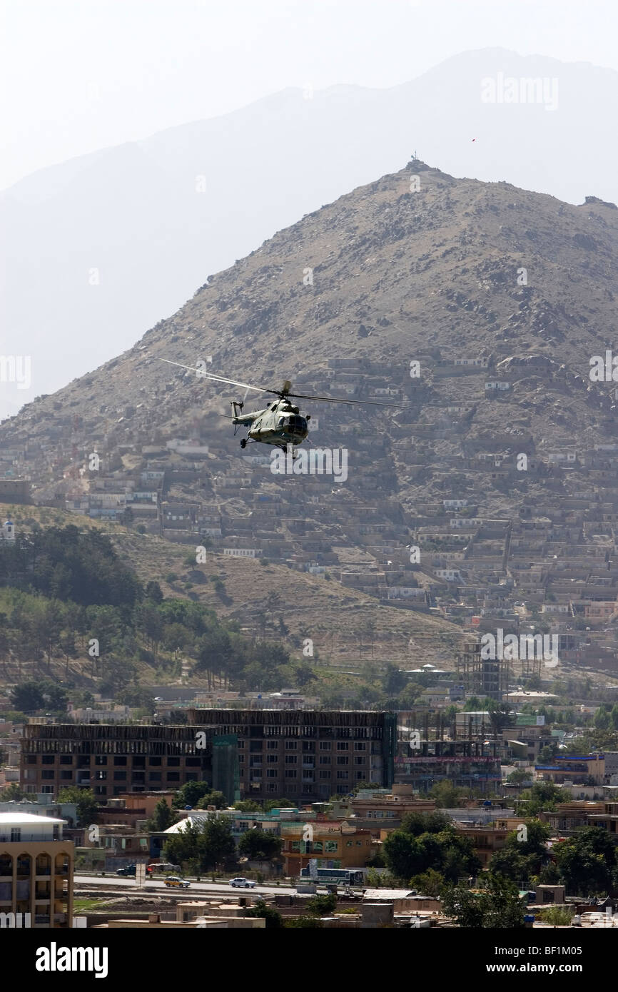 NATO ISAF helicopter flies over the city of Kabul Afghanistan on ...