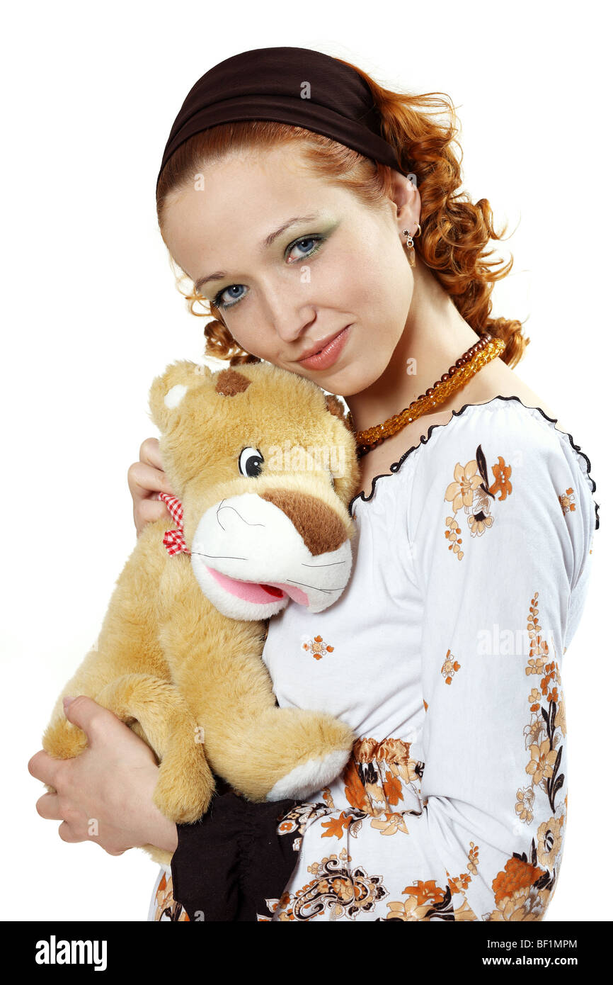 Young woman holding a plush lioness Stock Photo - Alamy