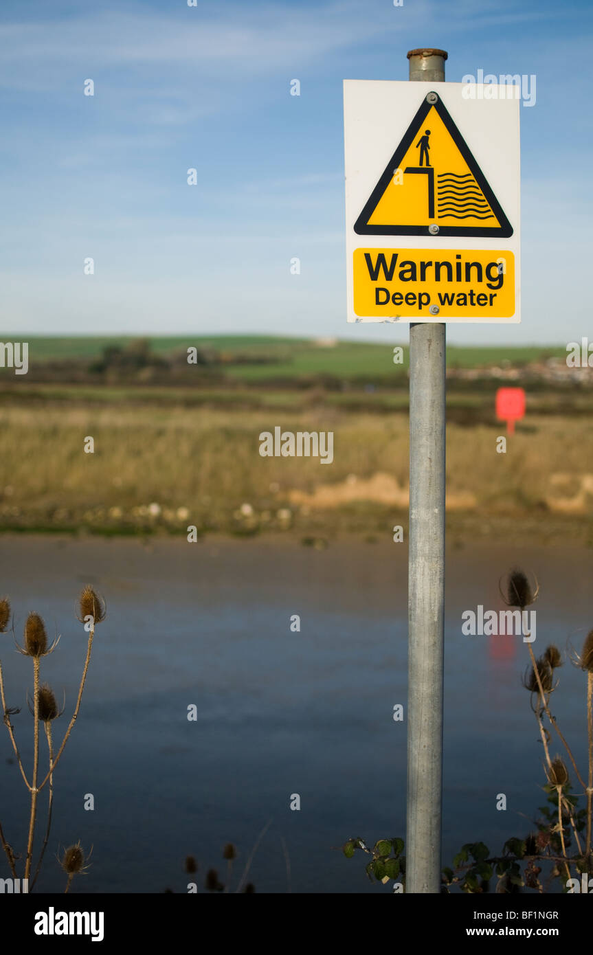 A sign warning of deep water Stock Photo - Alamy