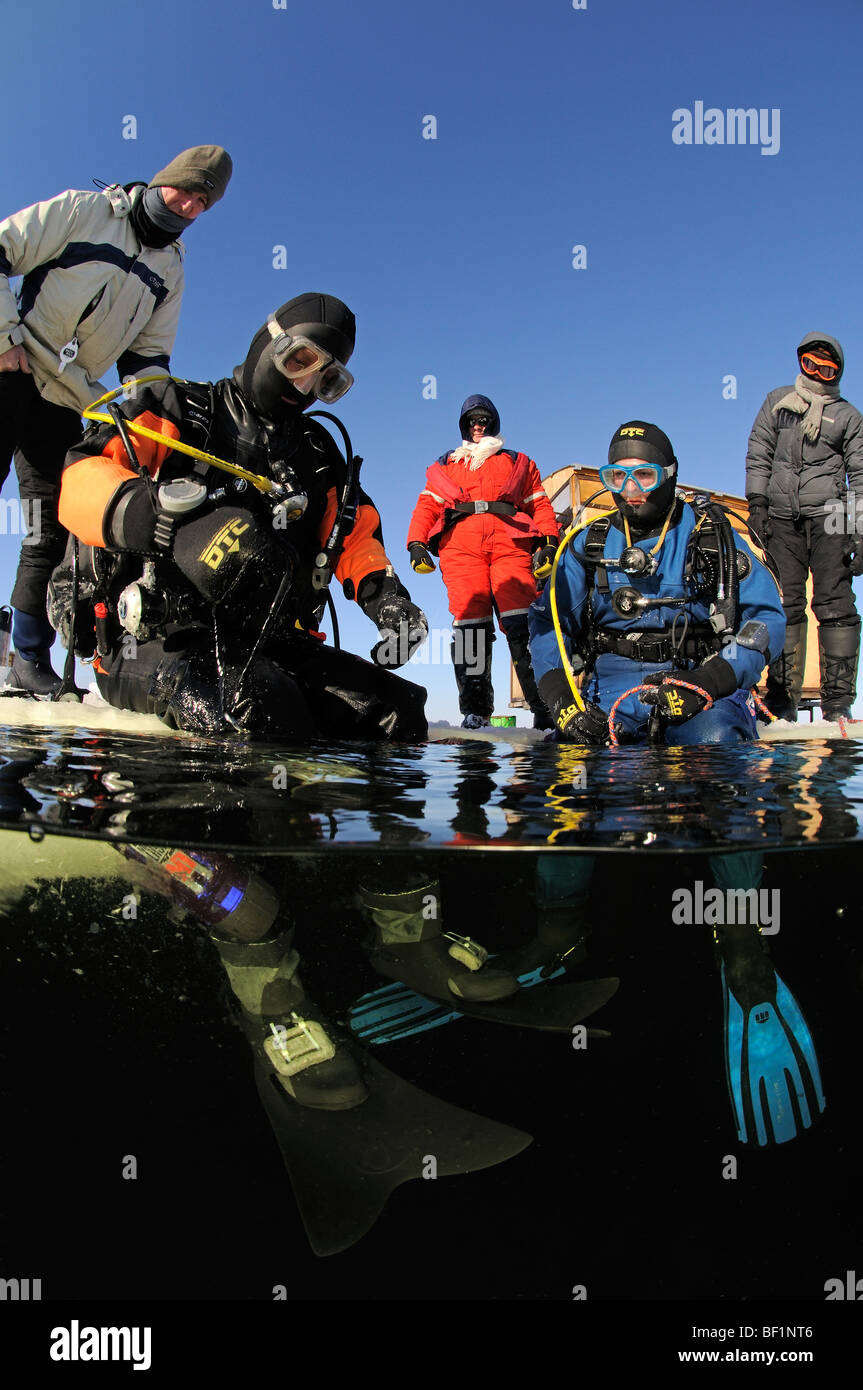 ice diving, split shot from ice divers and safty rope, White Sea ...