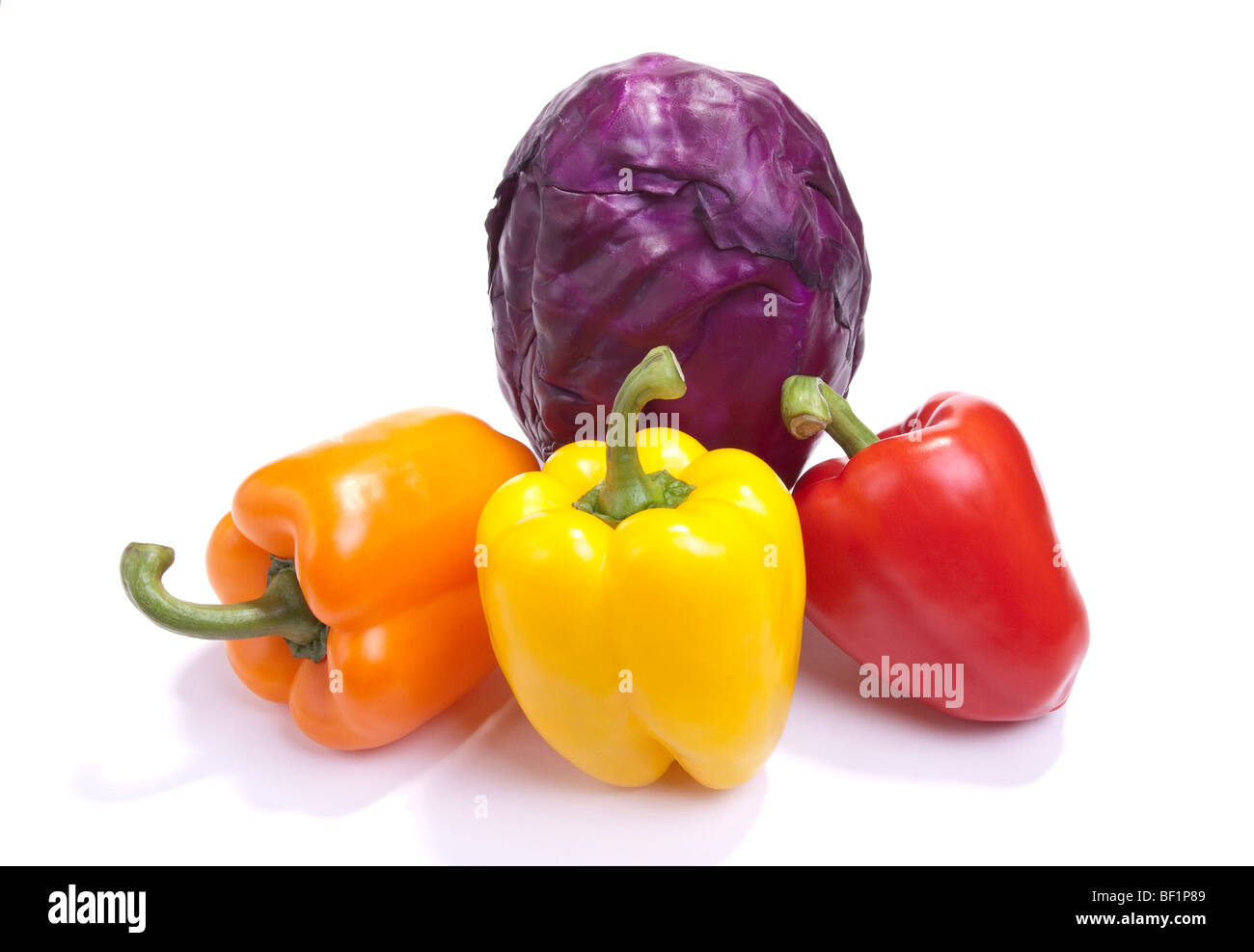 a selection of Brightly Coloured Vegetables isolated against white ...
