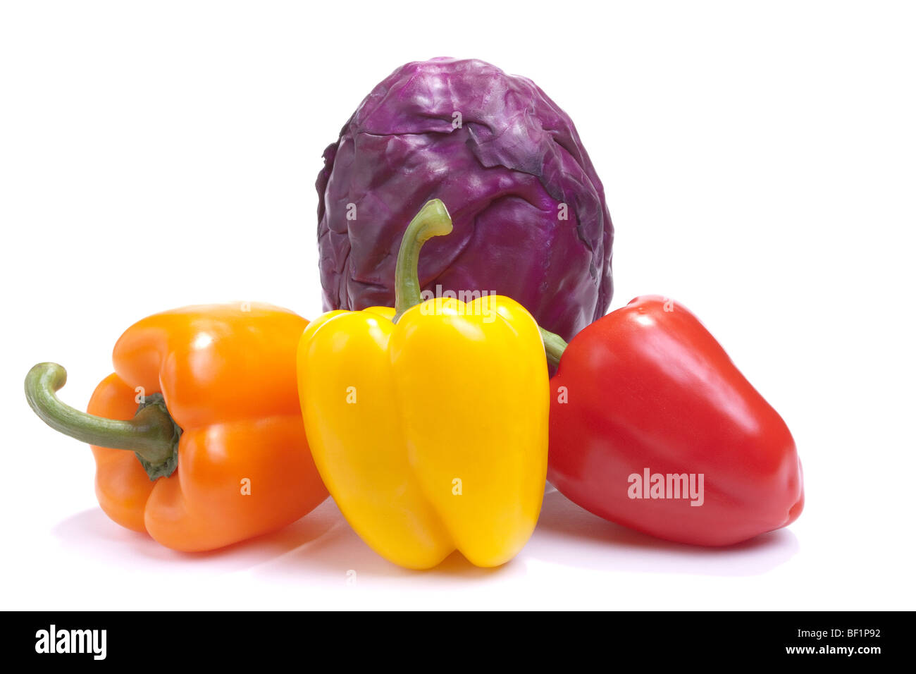 a selection of Brightly Coloured Vegetables isolated against white ...