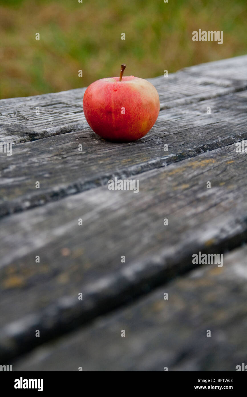Apple on table Stock Photo - Alamy