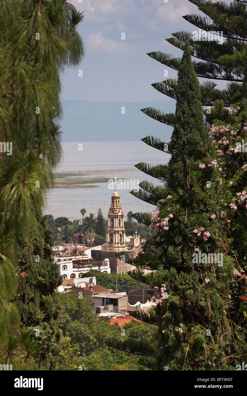 A view looking through mountain trees down at the baroque San Andres ...