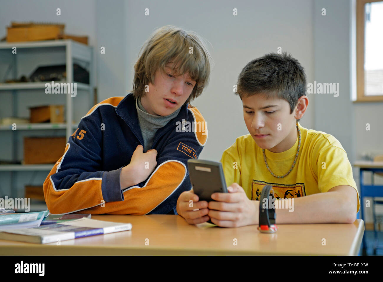 kids at school working with their calculator Stock Photo - Alamy