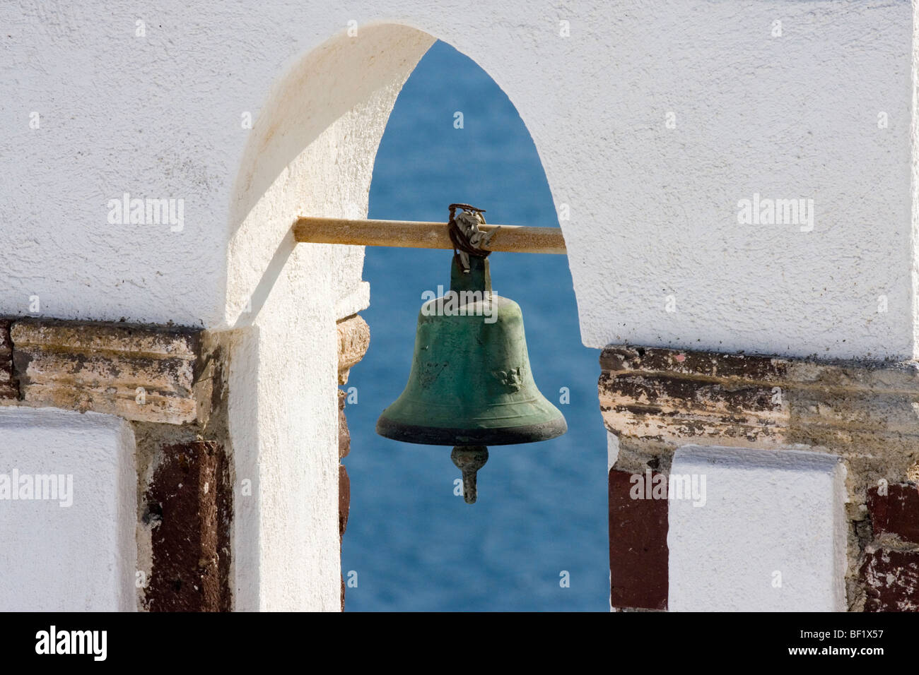 Hanging bell in arch Stock Photo - Alamy