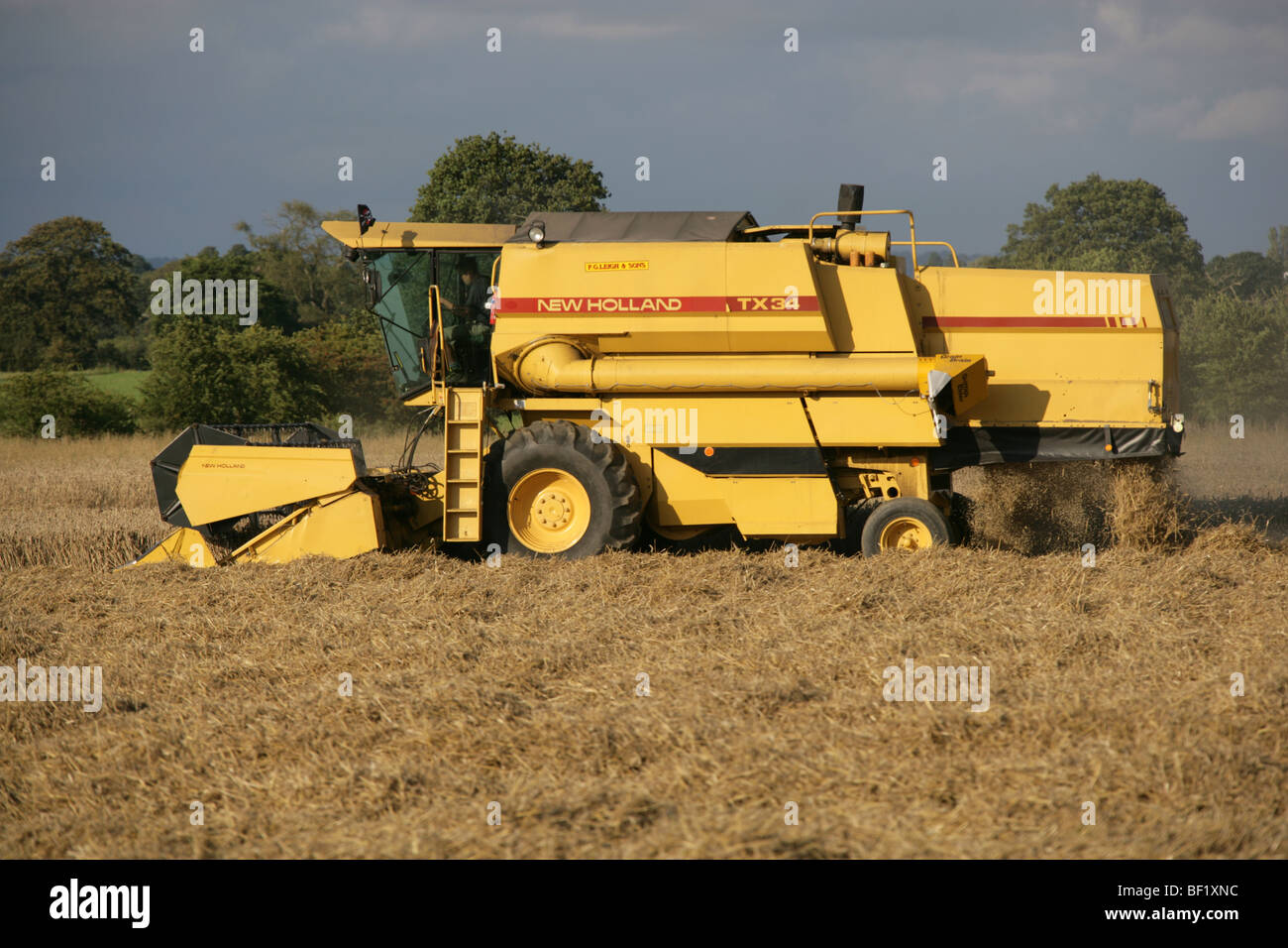 Village of Coddington, England. A New Holland TX34 Meca combine ...