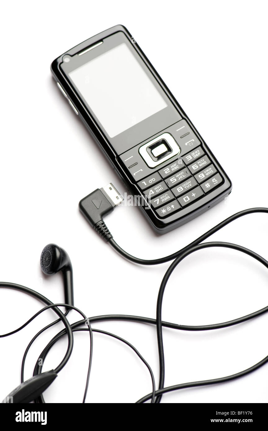 object on white - mobile phone with head set Stock Photo - Alamy