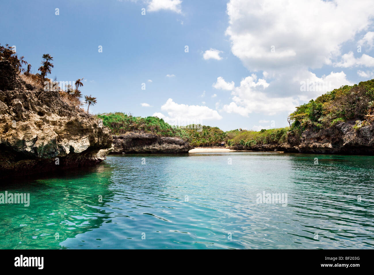 Rocks and white sand beach on the coastline of Guimaras Island ...