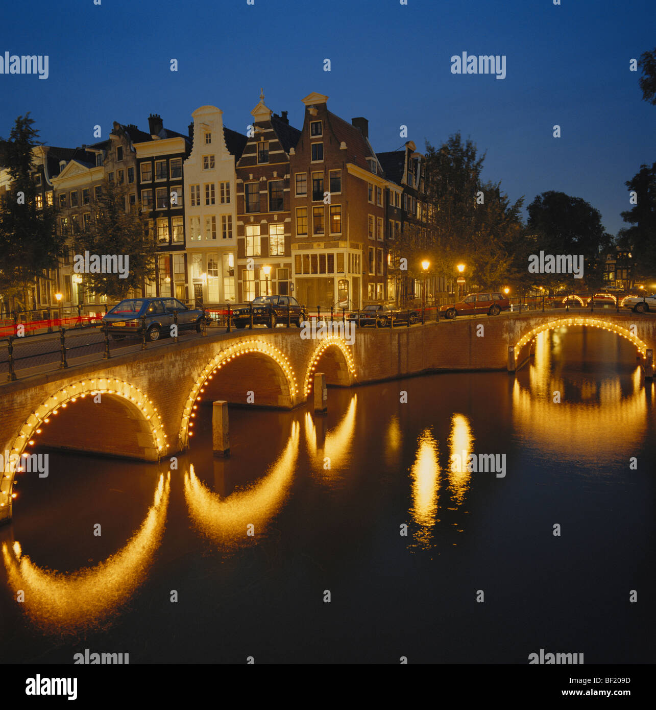 Floodlit canal bridges Amsterdam, Holland, the Netherlands Stock Photo ...