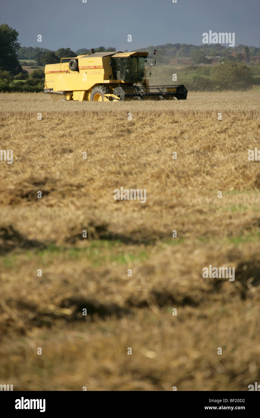 Village of Coddington, England. A New Holland TX34 Meca combine ...