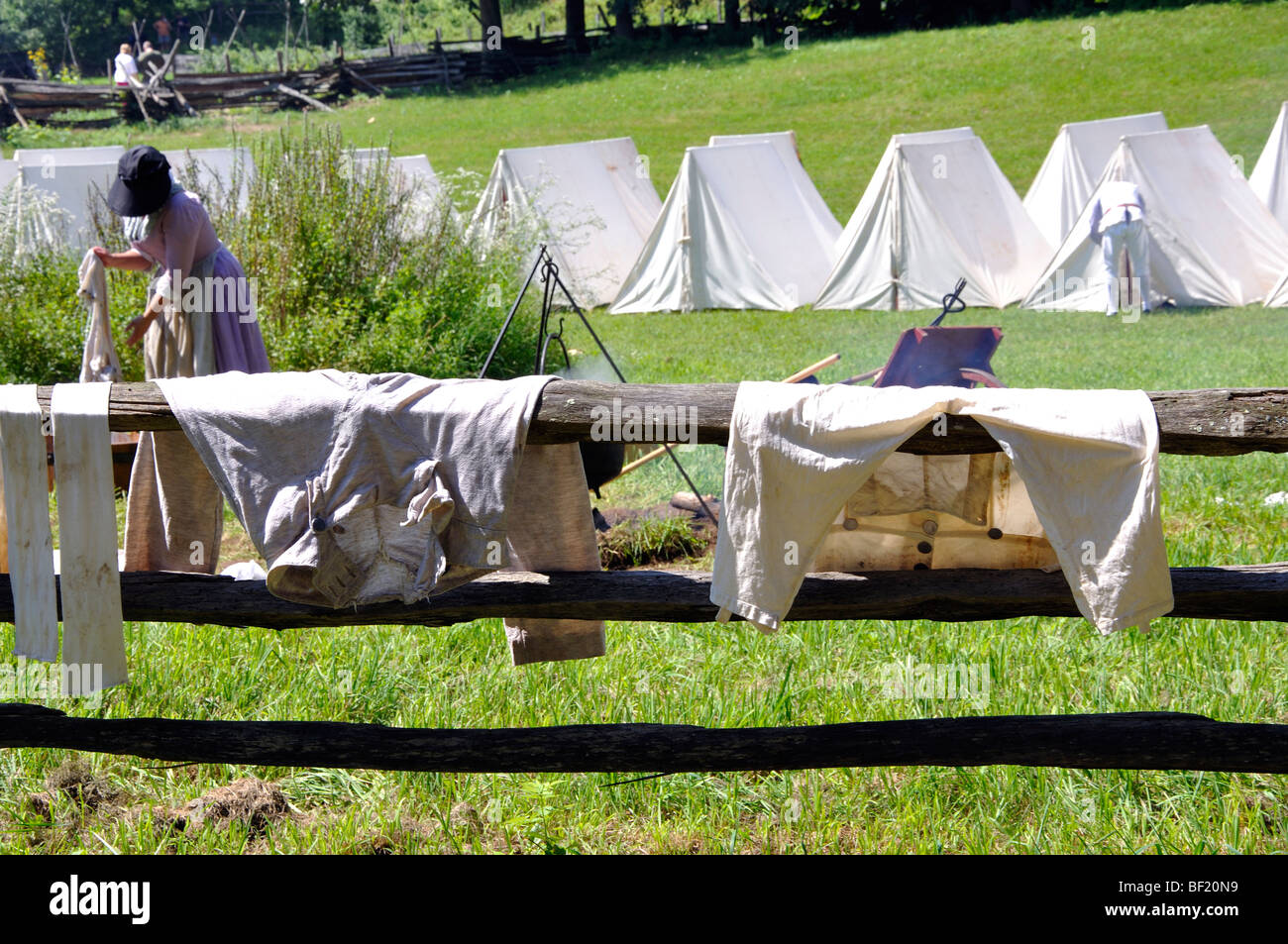 Clothes drying on fence in military tent camp - costumed American ...