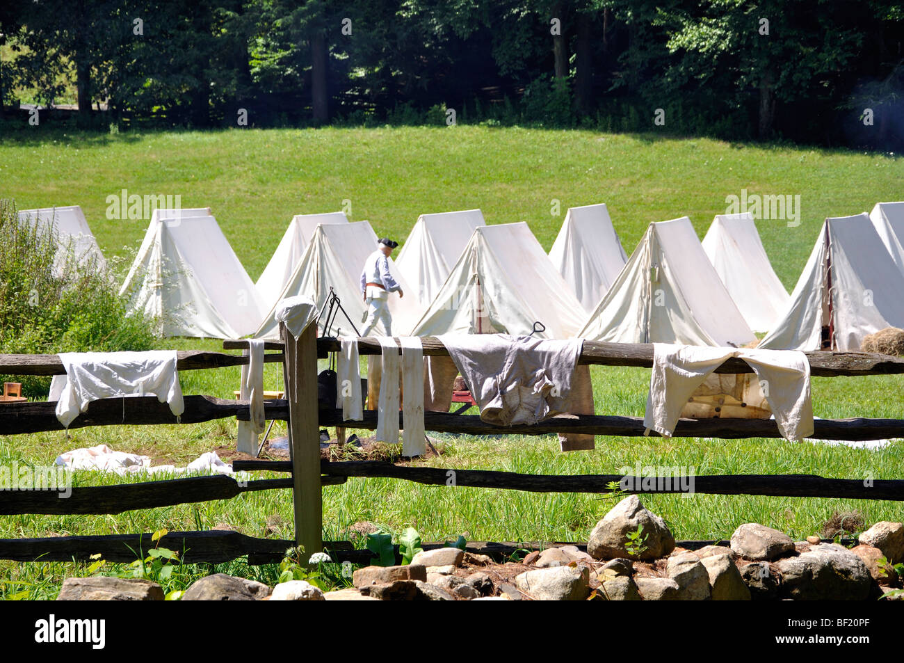 Clothes drying on fence in military tent camp - costumed American ...