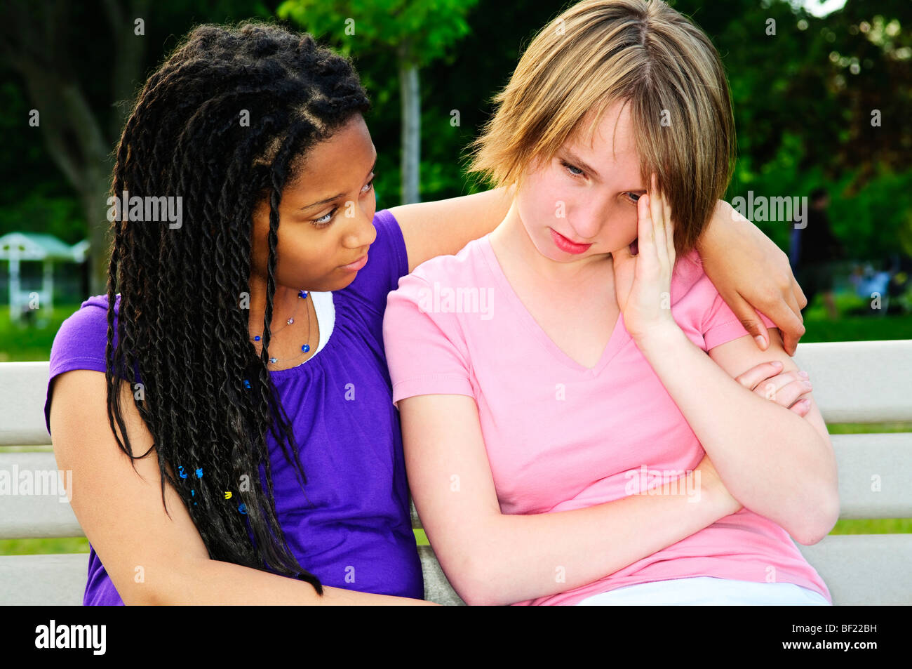 Teenage girl consoling her sad upset friend Stock Photo - Alamy