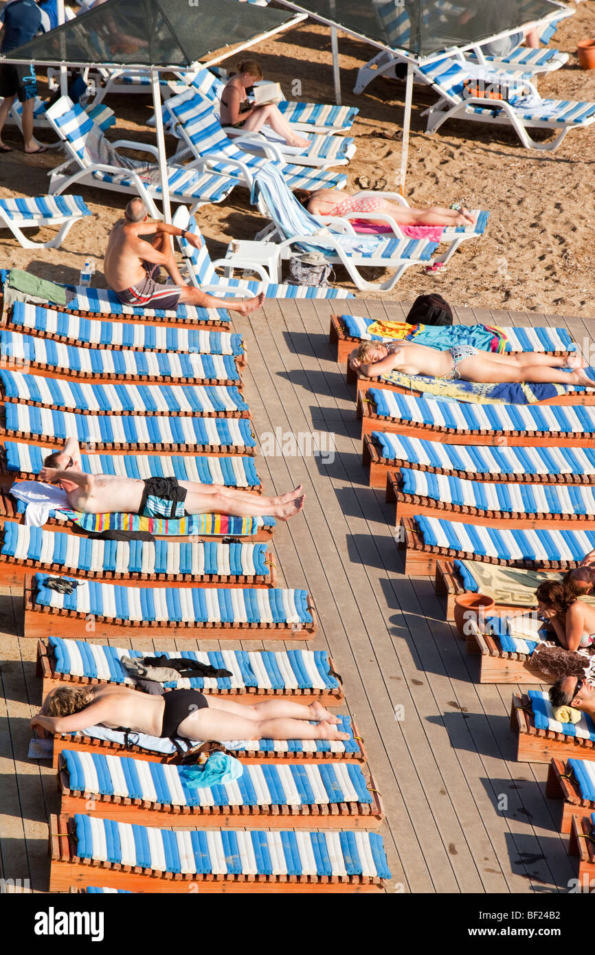 Sunbathing lungers at a holiday resort in Teos, Western Turkey Stock ...