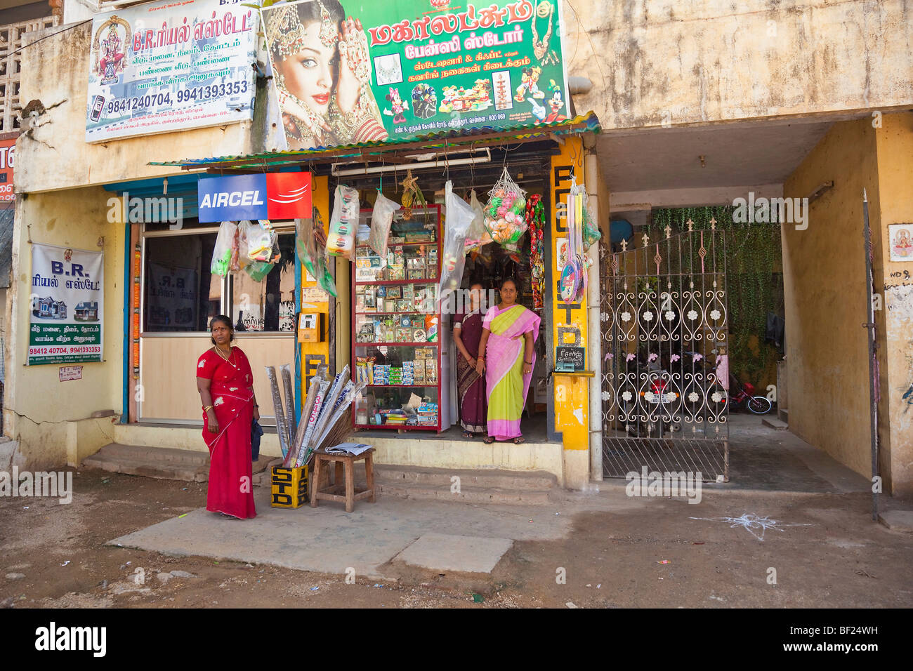 Indian woman standing outside a convenience store. Chennai Tamil Nadu ...