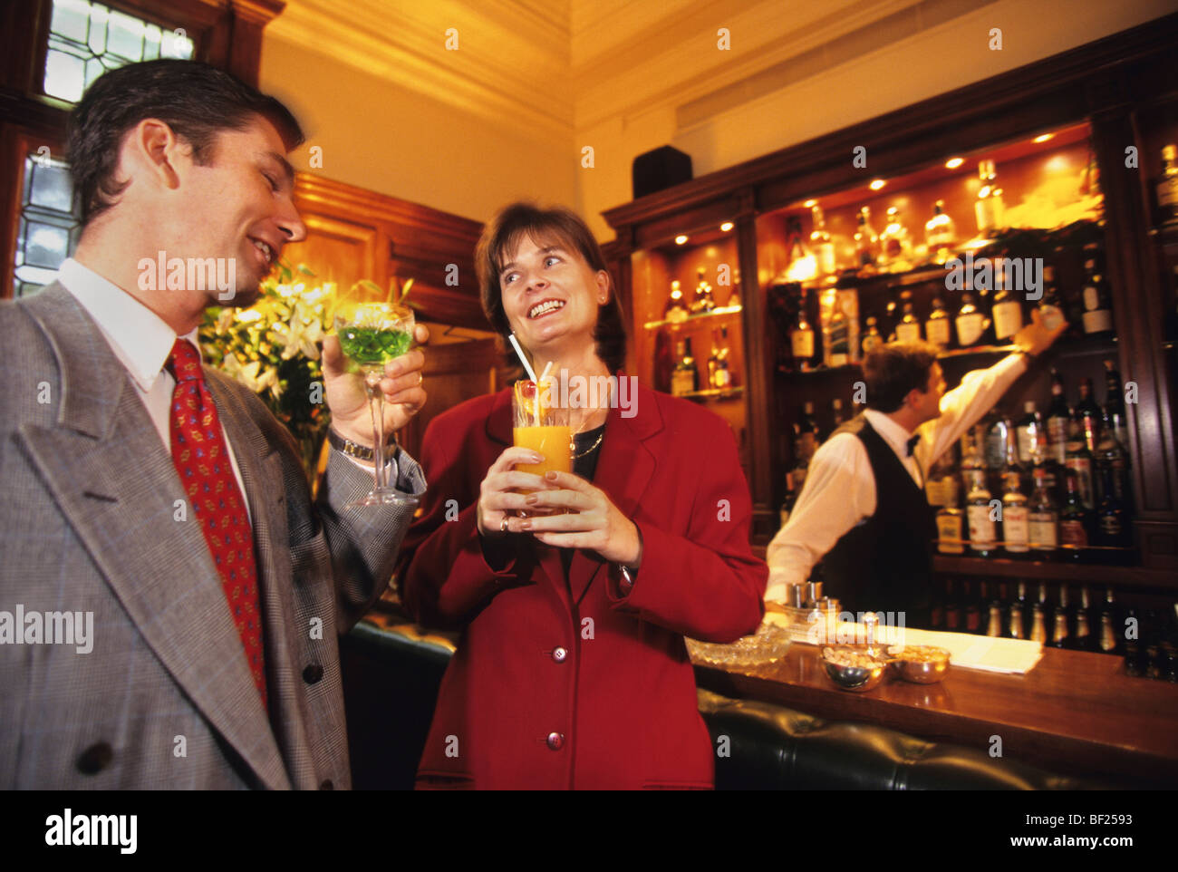 Man and woman drinking cocktails and Westbourne pub. London Stock Photo ...