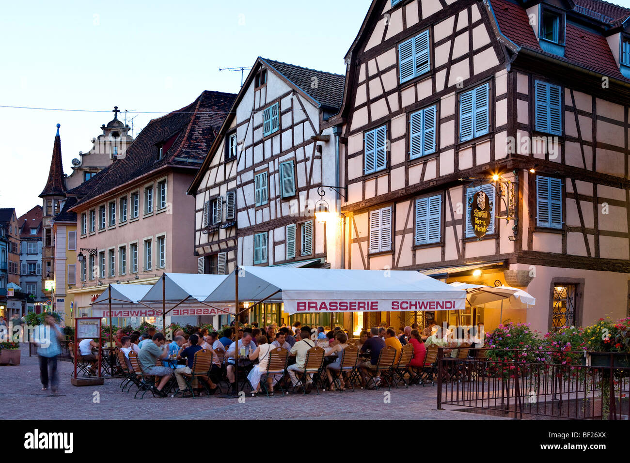 Cafe in the old town of Colmar in the evening light, Alsace, France ...
