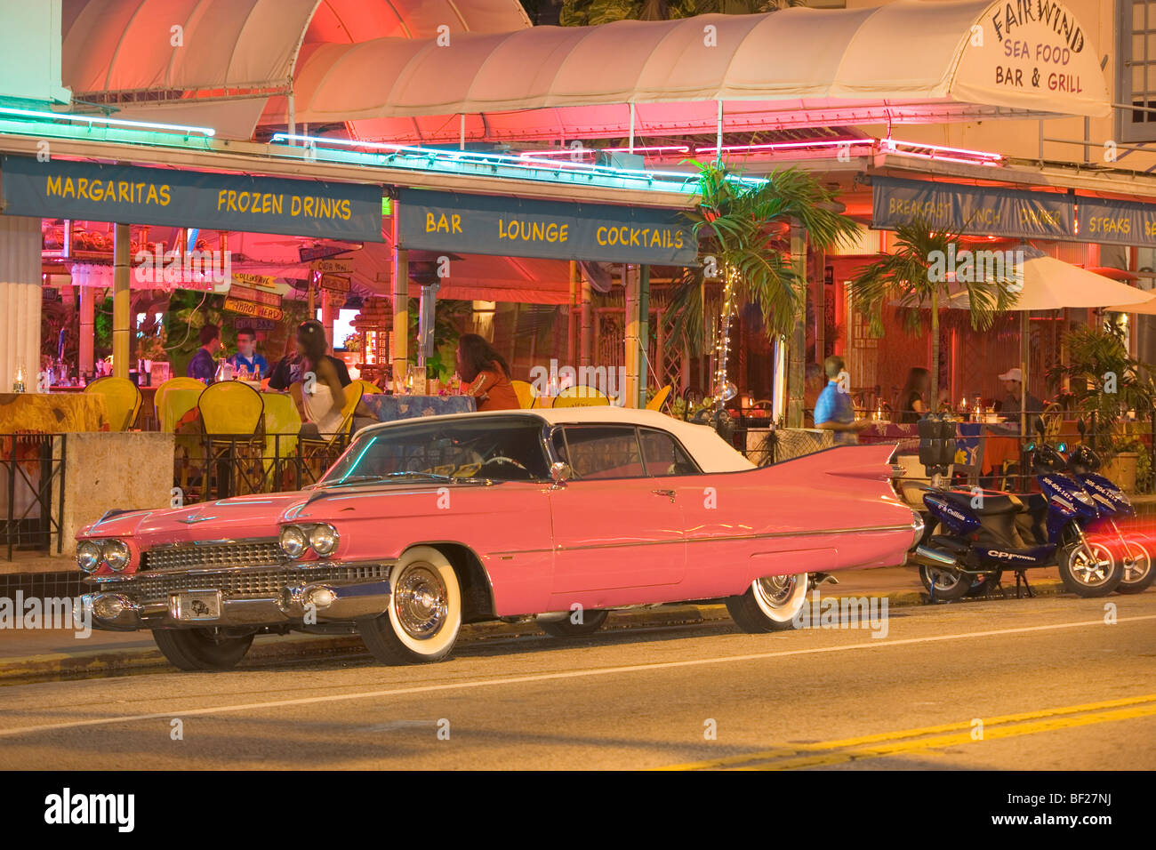 A vintage car on Collins Avenue in the evening, Miami Beach, Florida ...