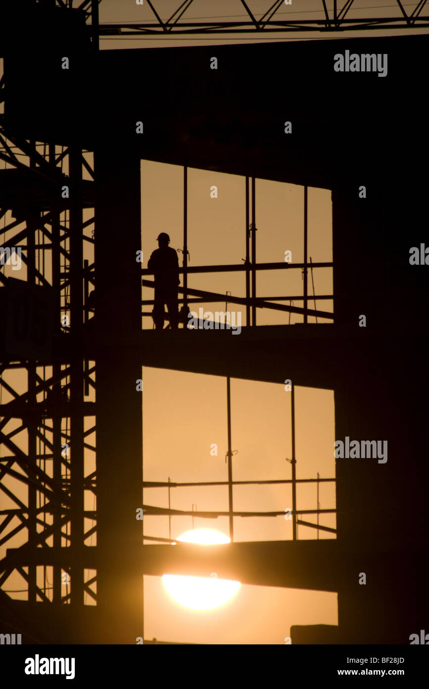 silhouette of builder and sun Stock Photo - Alamy