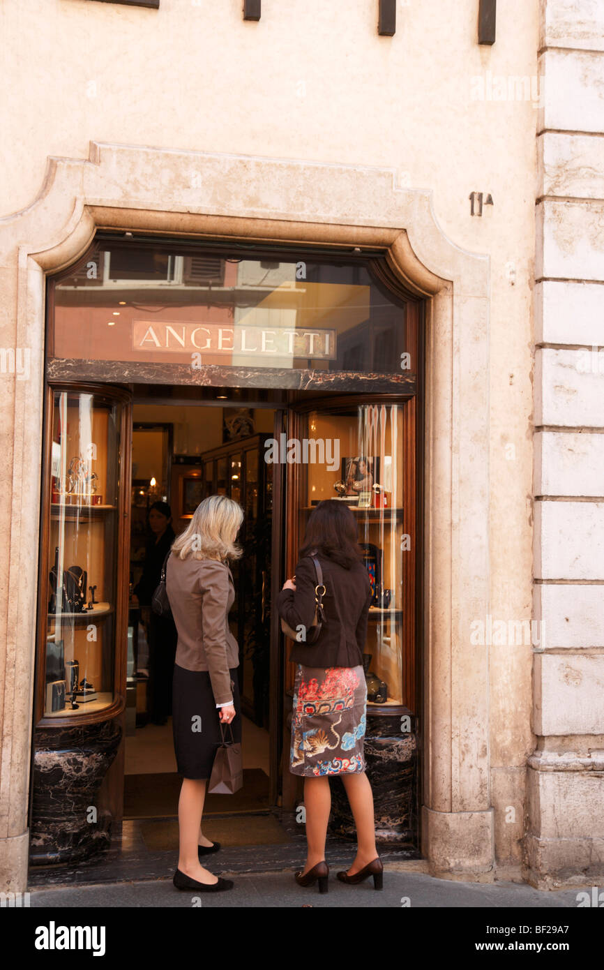 Two women looking at a shop window at Via Condotti, Rome, Italy Stock ...