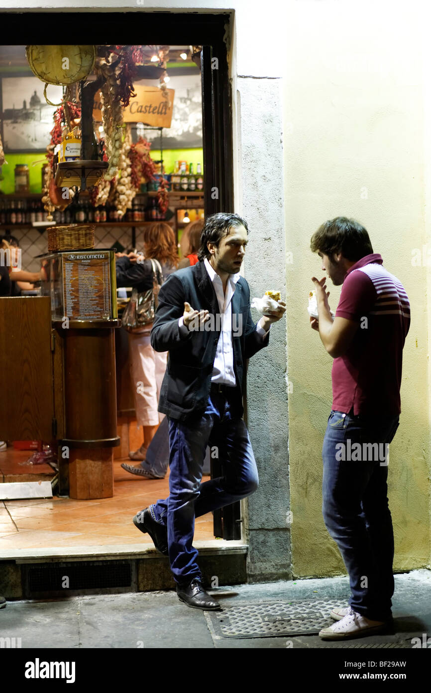 Two men outside a restaurant at Campo de Fiori, Rome, Italy Stock Photo ...