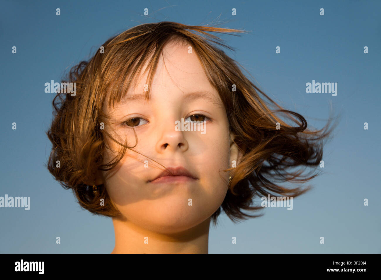 portrait of little girl - sear in the wind Stock Photo - Alamy