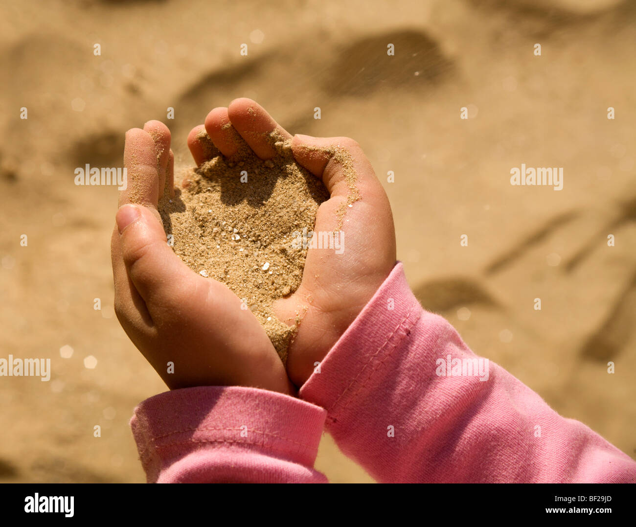 hands of child and sand Stock Photo - Alamy