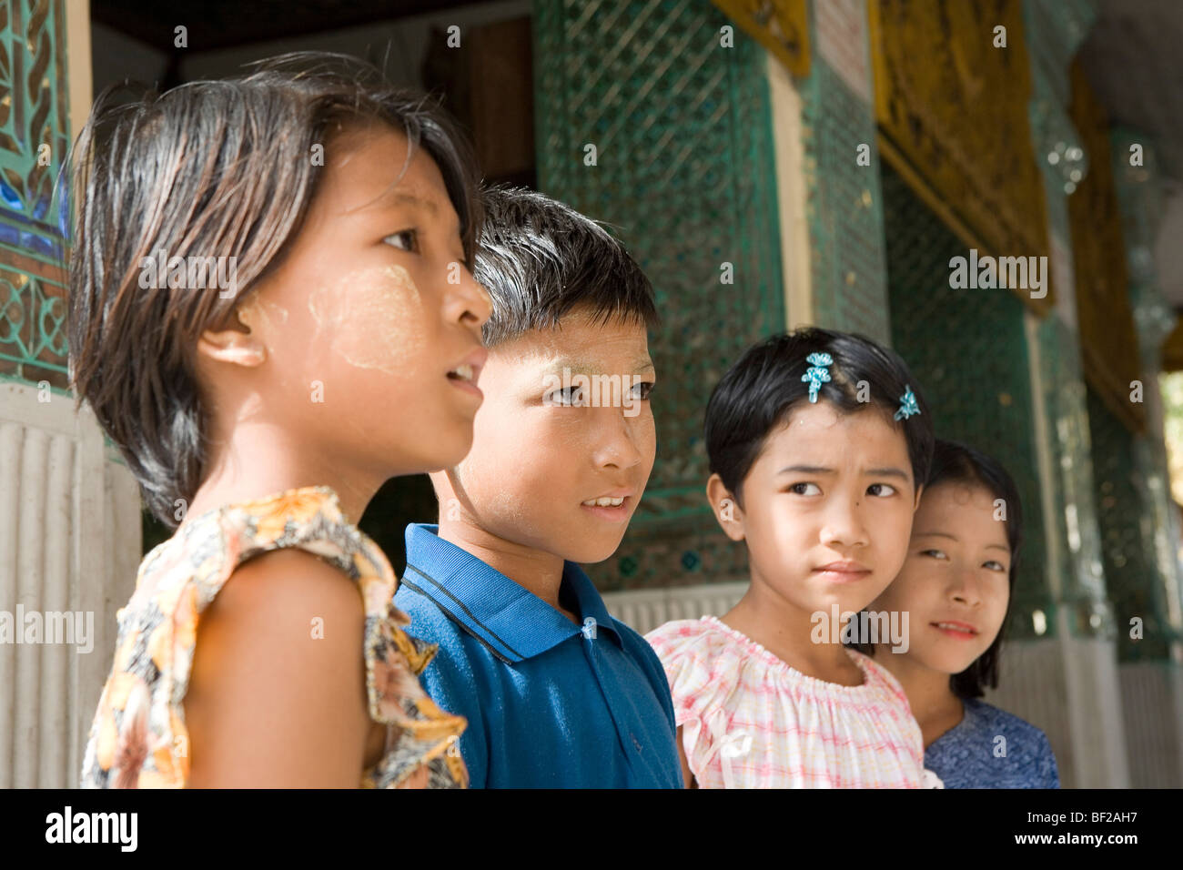 Four burmese children on the grounds of the Shwedagon Pagoda at Yangon ...