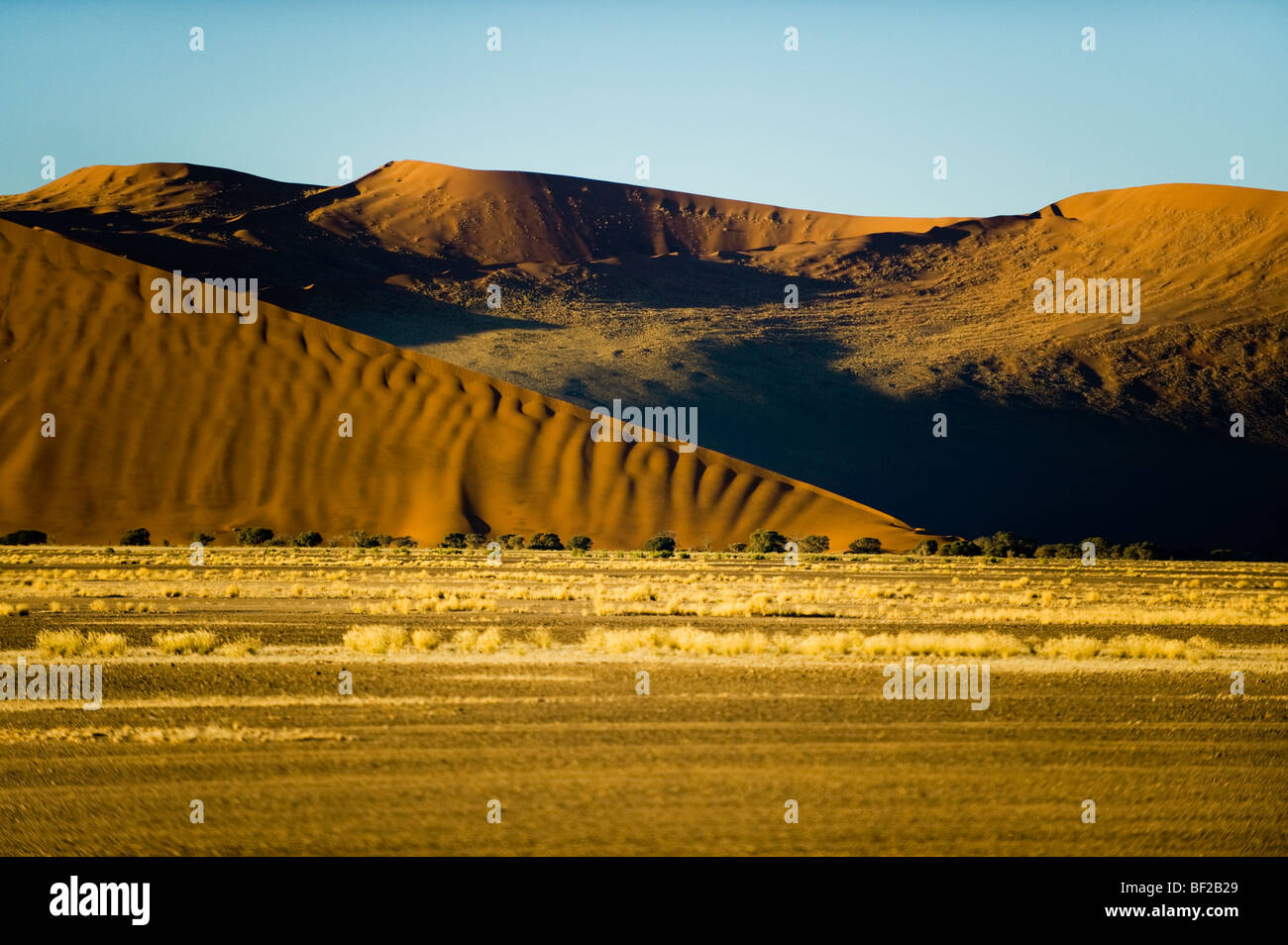 sunset NAMIBIA desert SOSSUSVLEI dunes yellow red orange sand dust wide ...