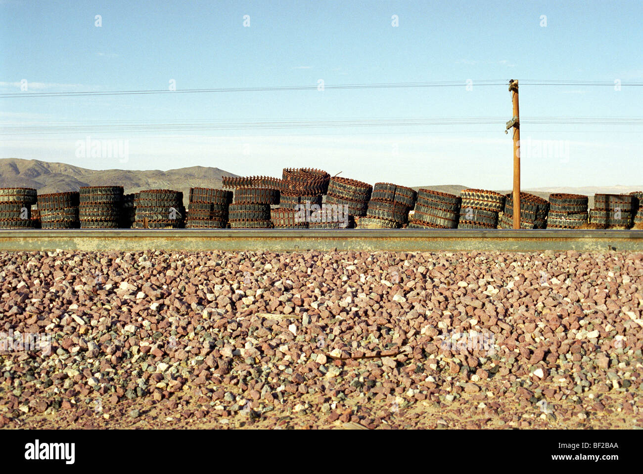 Rusty tracks of tracked vehicles and train tracks, Mojave Desert ...