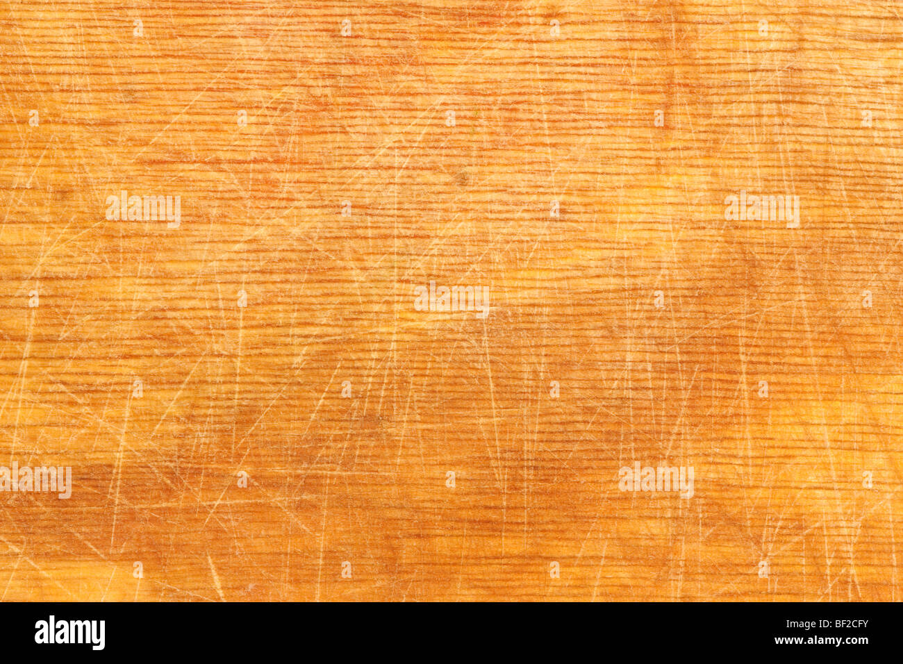 Well-used wood chopping board providing good texture for backgrounds ...