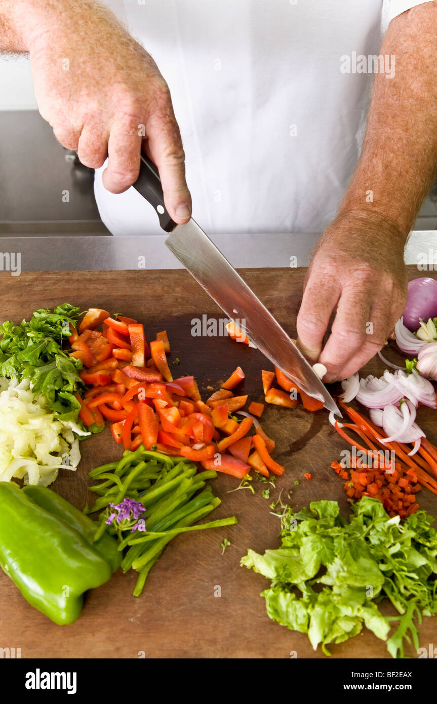 Chef chopping vegetables with a knife Stock Photo - Alamy