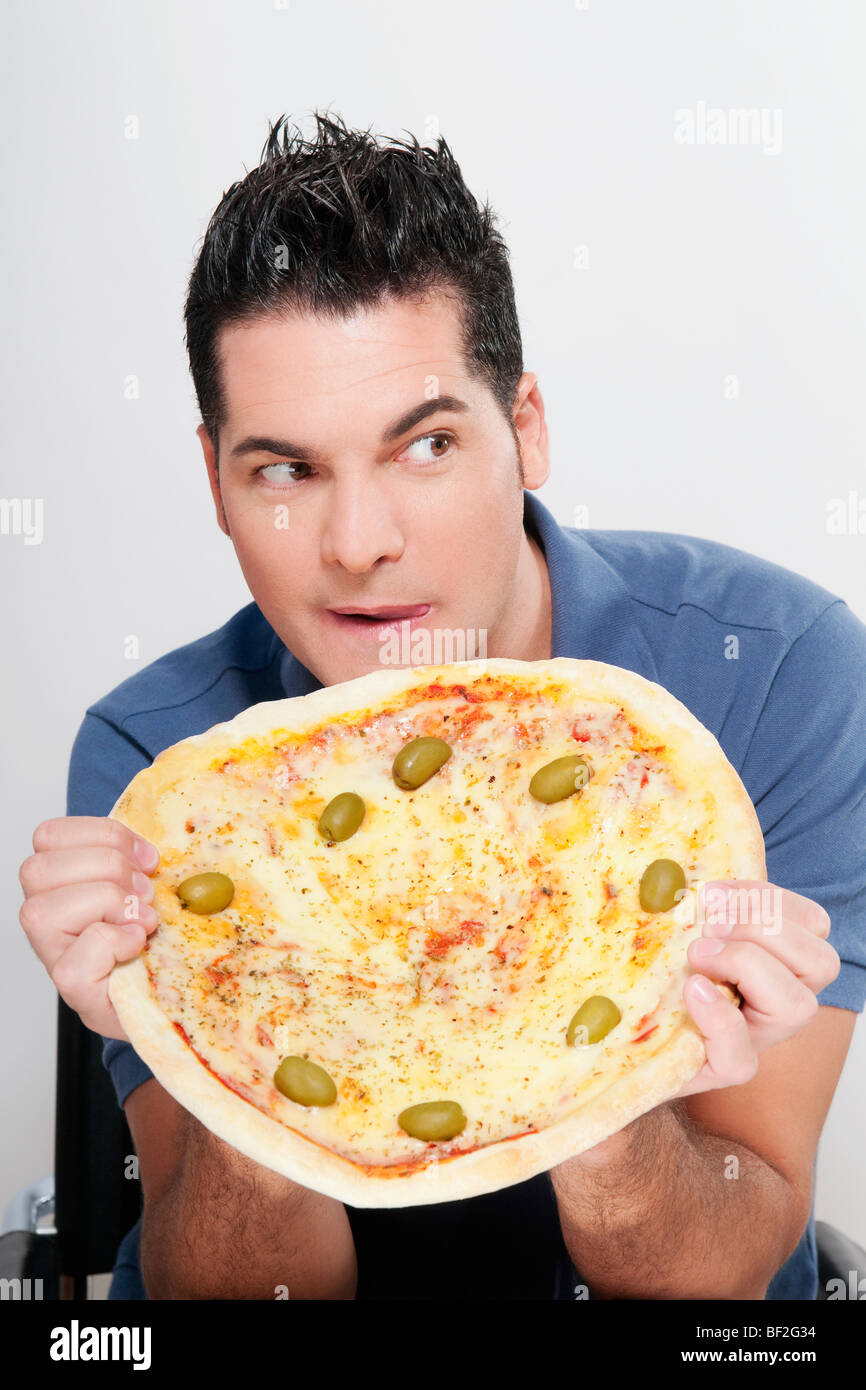 Man holding a pizza Stock Photo - Alamy