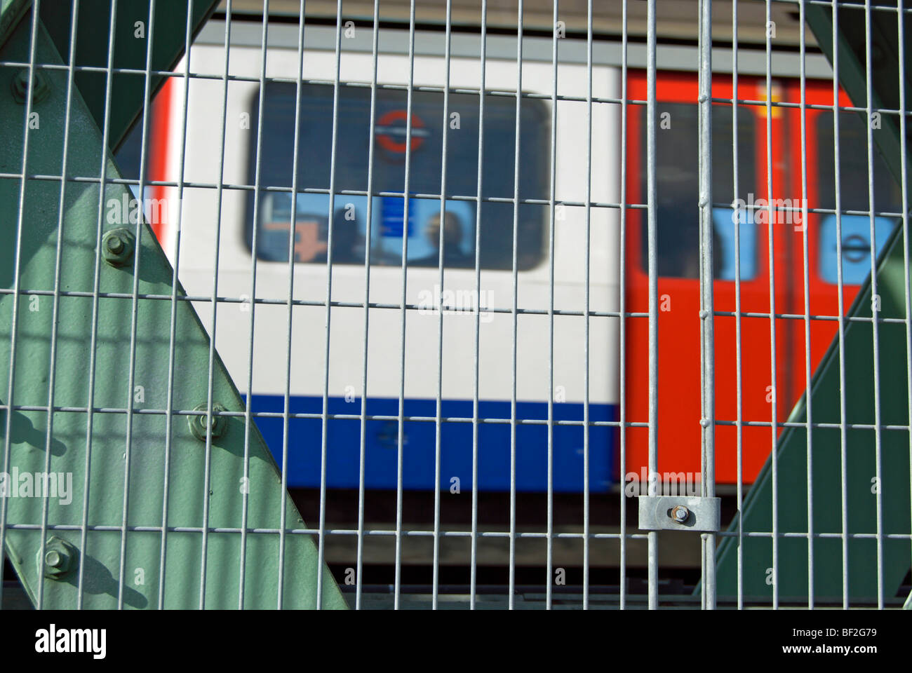 london underground train crossing putney rail bridge, southwest london ...