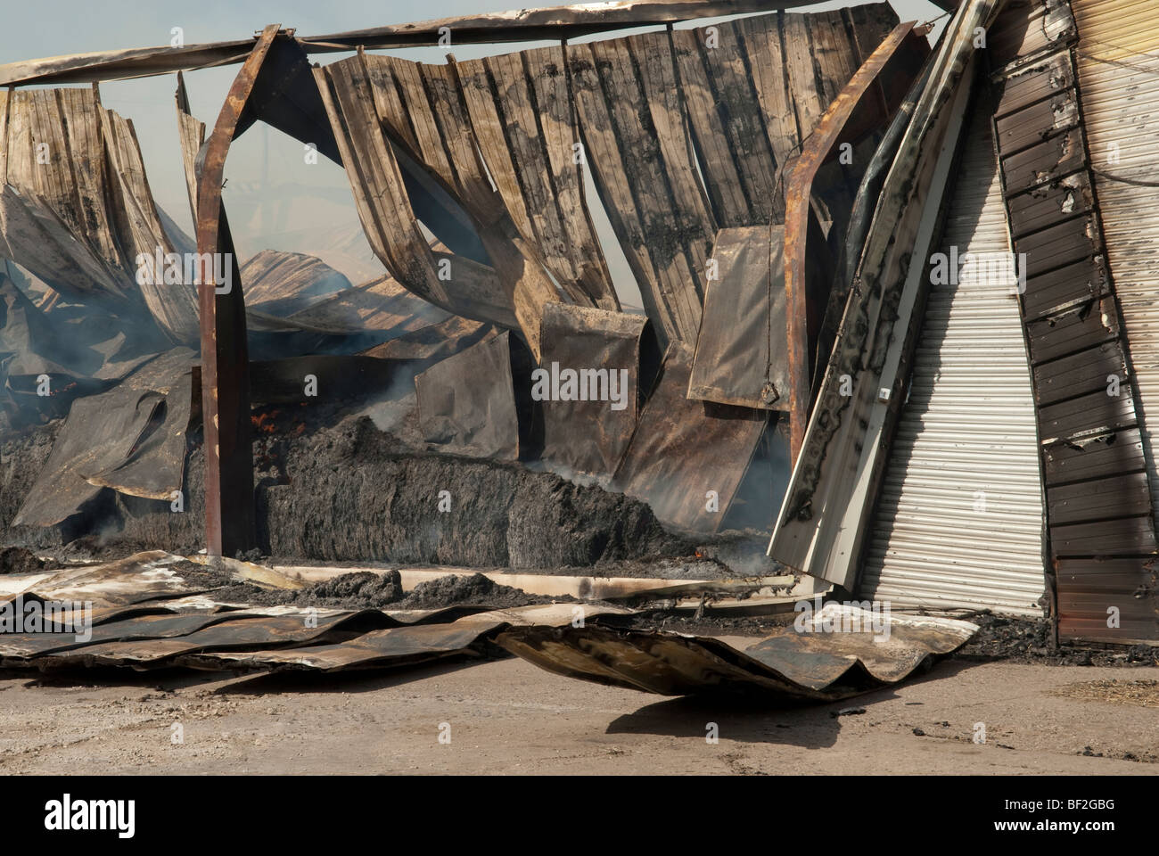 Farmers barn of corrugated metal construction on fire containing hay ...