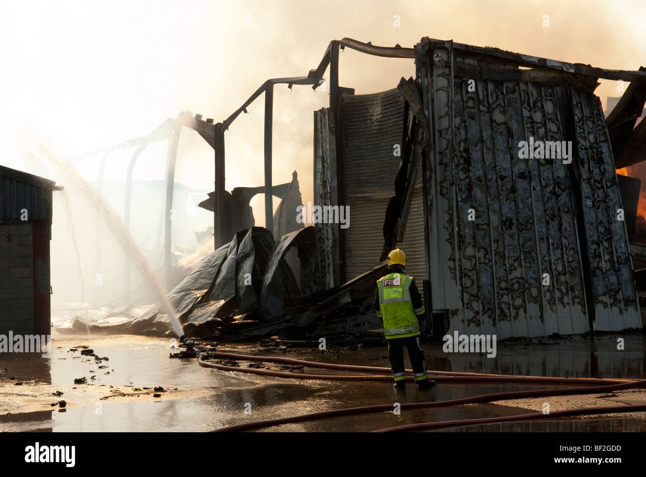 Farmers barn of corrugated metal construction on fire containing hay ...